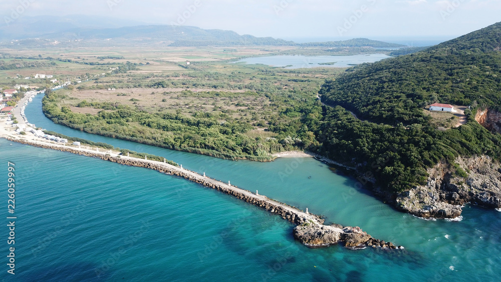 Aerial drone photo of unique beauty of caves and beach o Amoudia near ...