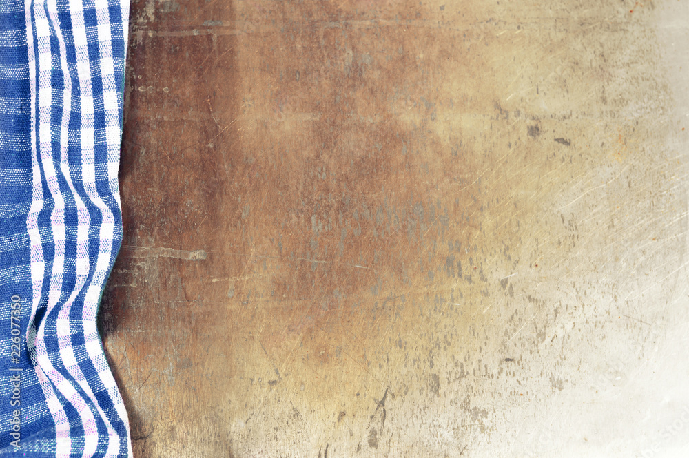 Cooking background. Blue checkered tablecloth on grunge background ...