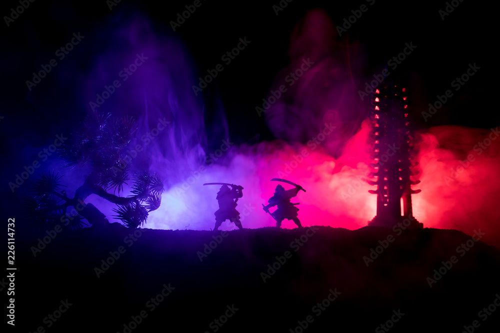 Samurai fighting concept. Silhouette of samurais in duel near tree and ...