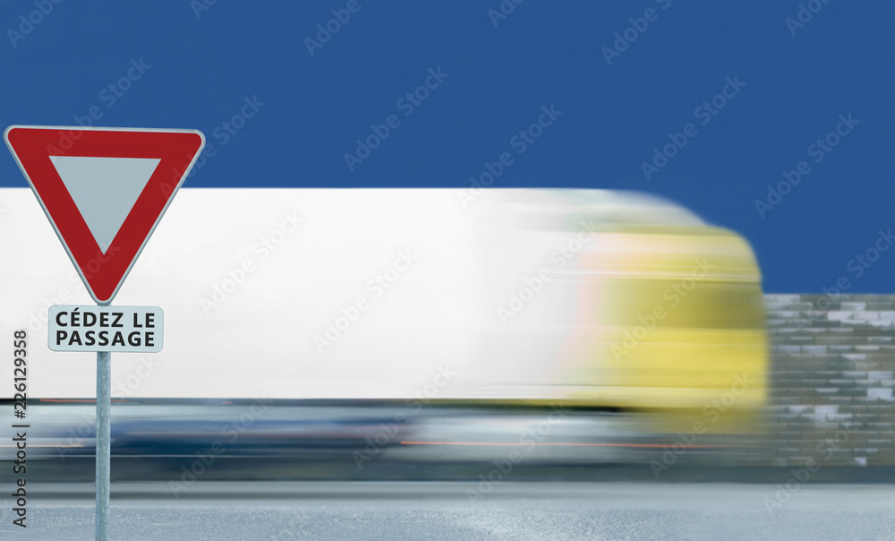 Give way yield french cédez le passage road sign motion blurred truck ...