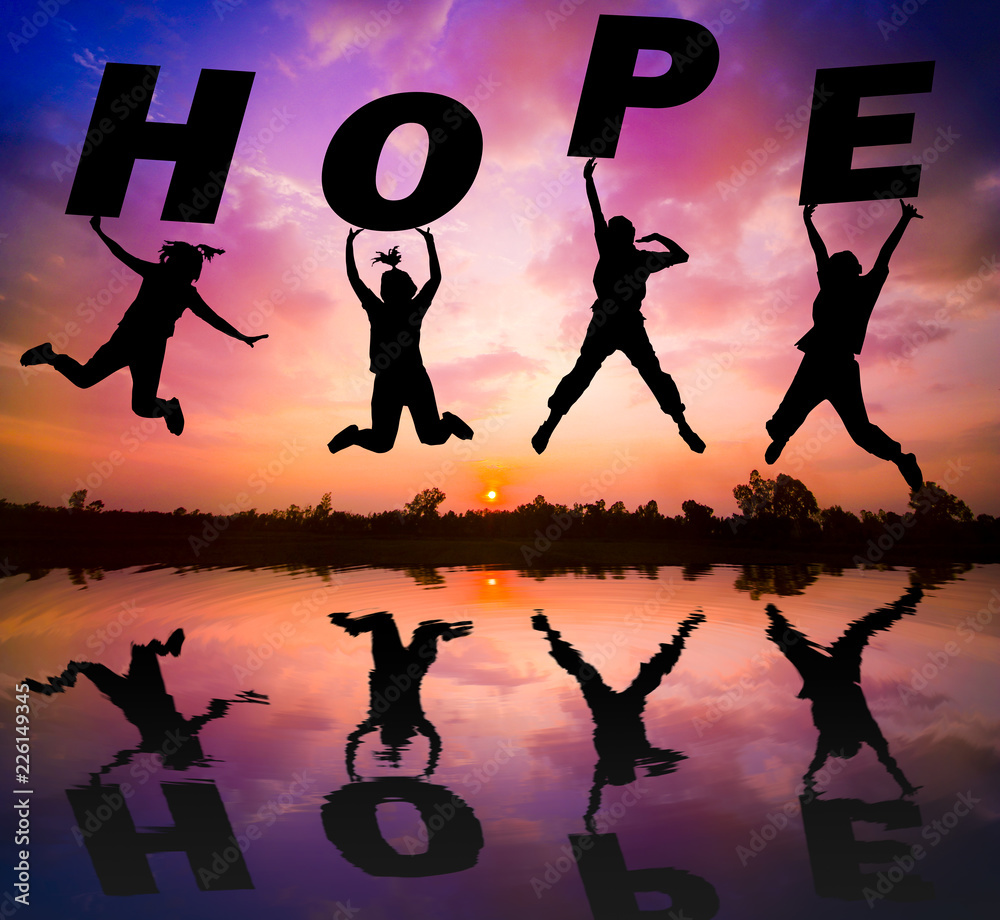 Silhouette and reflection in water sunset background.They are jumping ...