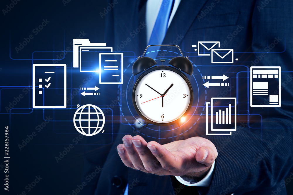 Man hand with alarm clock, time management Stock Photo | Adobe Stock