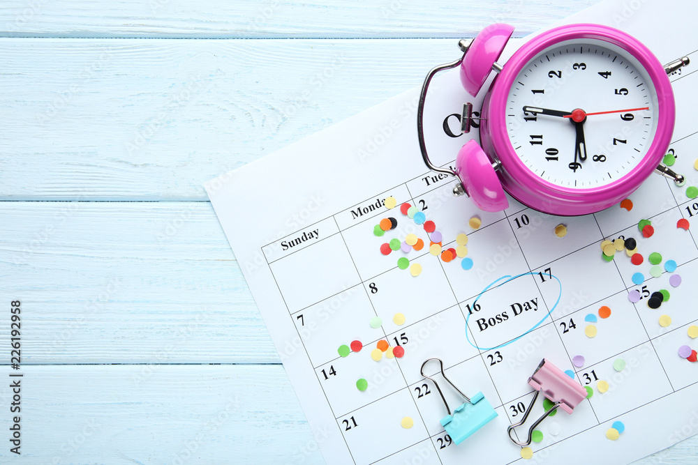 Inscription Boss Day in calendar with alarm clock and confetti Stock ...