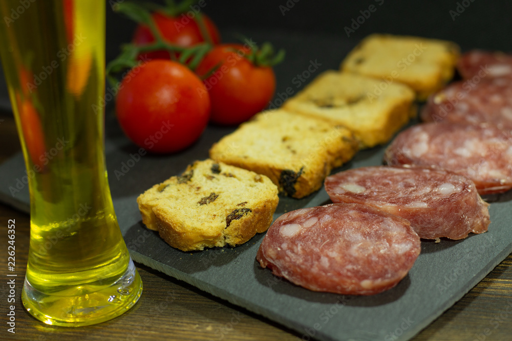 Tabla de embutido español con pan y tomate Stock Photo | Adobe Stock