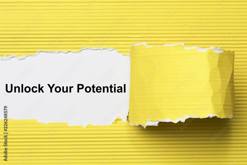 unlock your potential text on paper. Word unlock your potential on torn ...