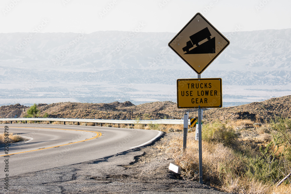 Sign warns truck drivers to use lower gear on the steep Palm to Pines ...