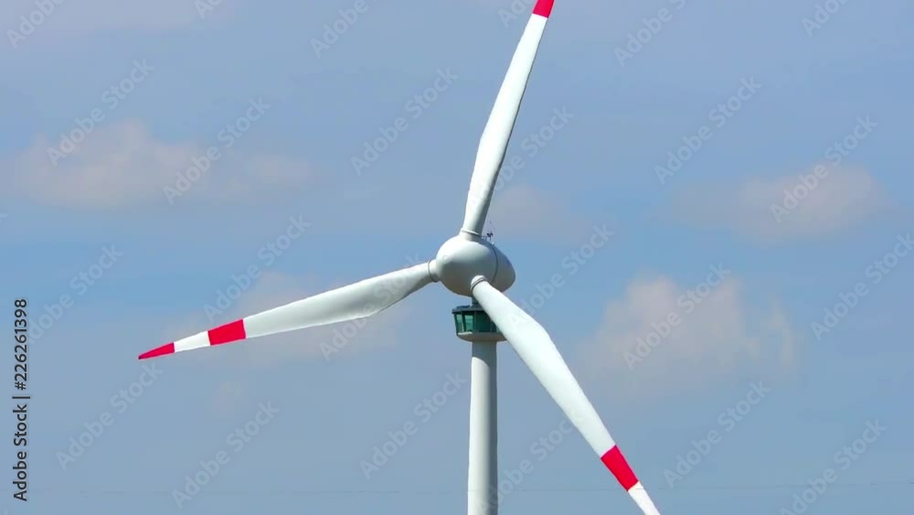 4K footage of wind turbines (aerofoil-powered generators) creating ...