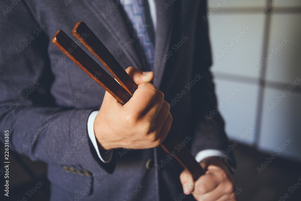 Man with leather tawse. Strict headmaster with tawse. Corporal ...