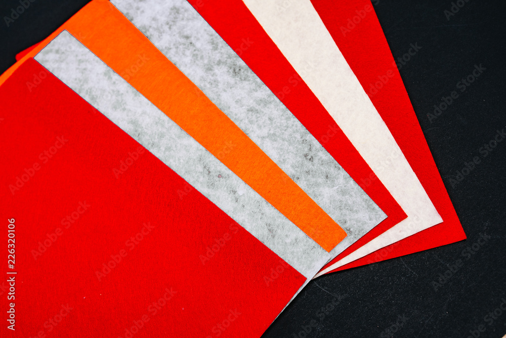 Red colored bright felt textile material. Samples of soft felt. Craft ...
