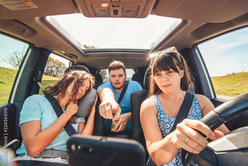 Foto de checking navigation in car. wrong direction. road trip do Stock ...