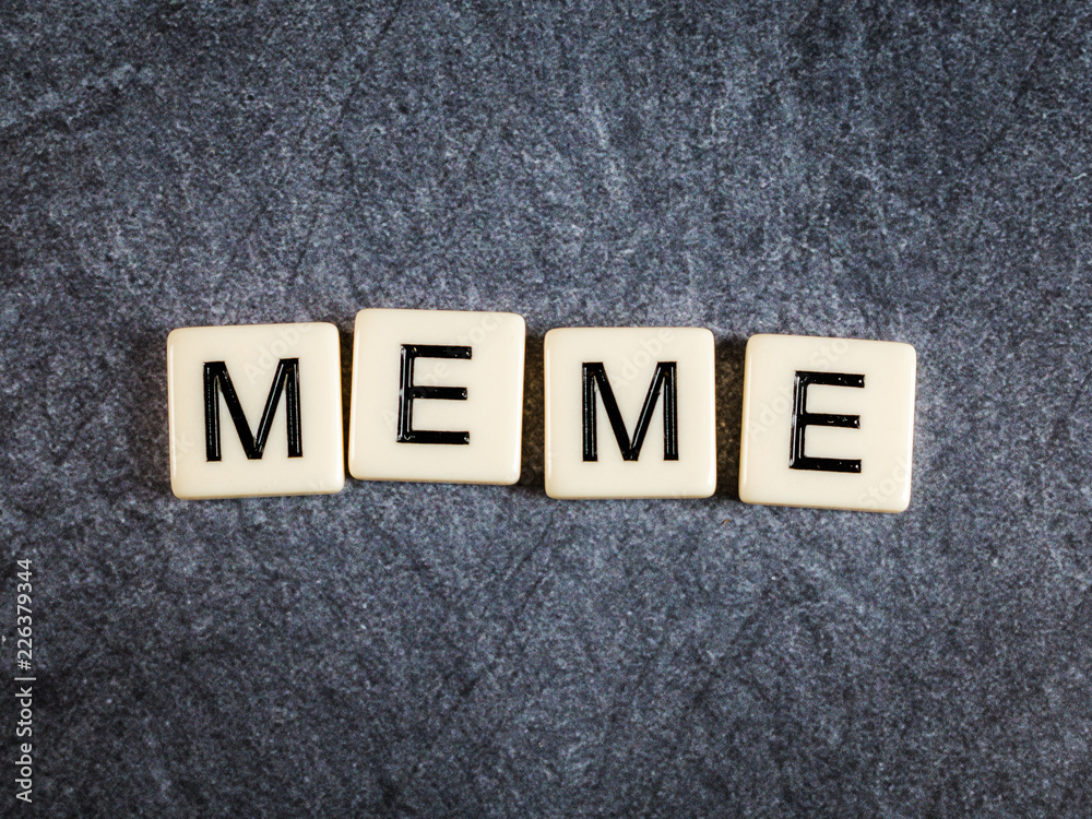 Letter tiles on black slate background spelling Meme Stock Photo ...