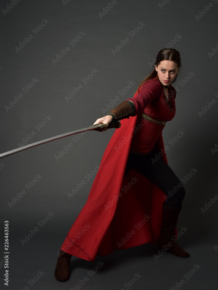 full length portrait of brunette girl wearing red medieval costume and ...