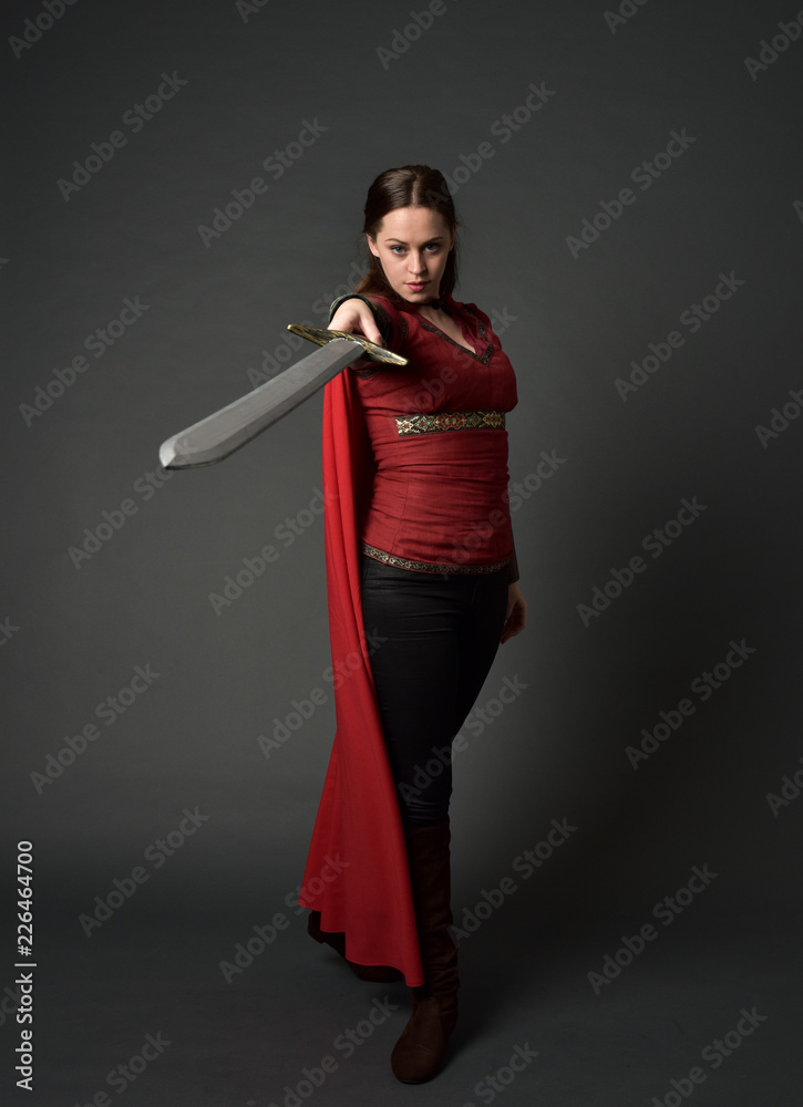 full length portrait of brunette girl wearing red medieval costume and ...