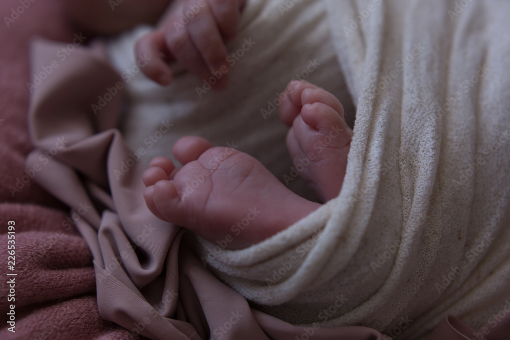 the legs of the newborn baby. the legs of the newborn flaky skin. peel ...