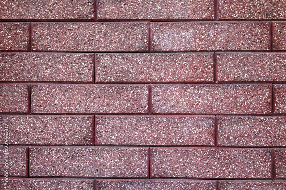 The wall of maroon facing bricks. Background and texture Stock Photo ...