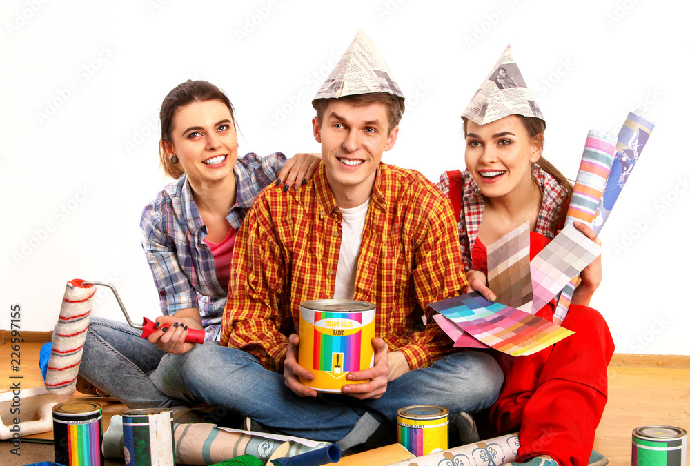 Repair group people building home using paint roller tools and can of ...