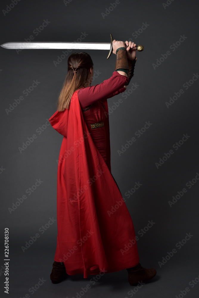 full length portrait of brunette girl wearing red medieval costume and ...