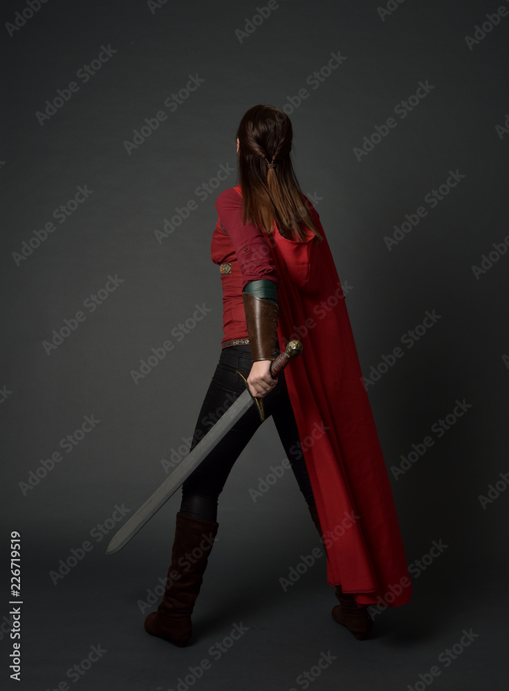 full length portrait of brunette girl wearing red medieval costume and ...