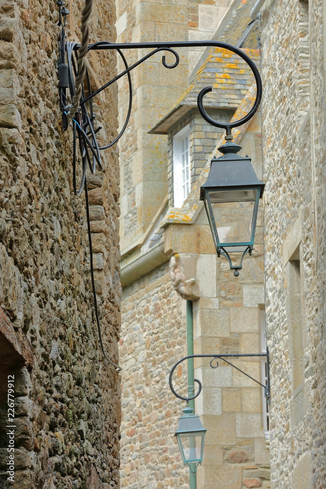 Alignment of street lamps in a narrow alley (Mahe de la Bourdonnais ...