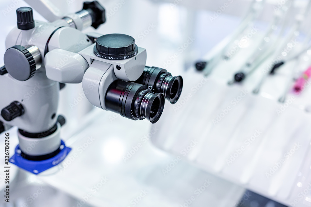 Dental microscope on the background of modern dentistry. Medical ...