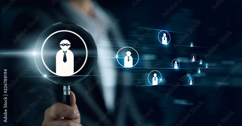 Businessman holding magnifying glass, searching for good and quality ...