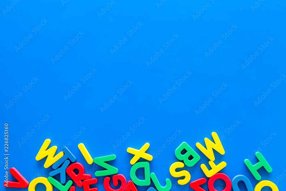 Alphabet for kids concept. English letters in disorder on blue ...