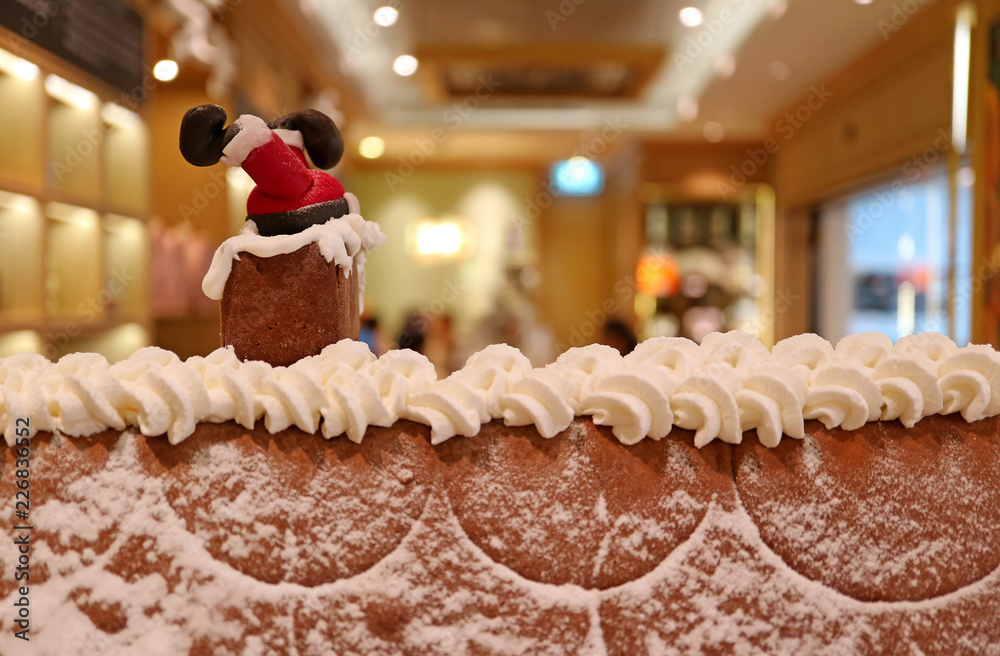 Marzipan Santa Claus stuck in the chimney on the gingerbread house's ...