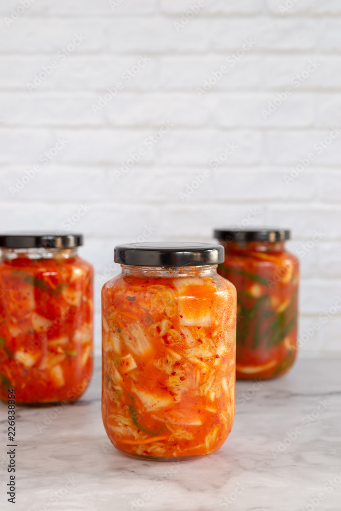 homemade cabbage kimchi in a glass jar Stock Photo | Adobe Stock
