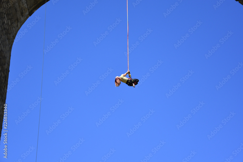 Bungee jumping from railway bridge. Seen from the ground beautiful ...