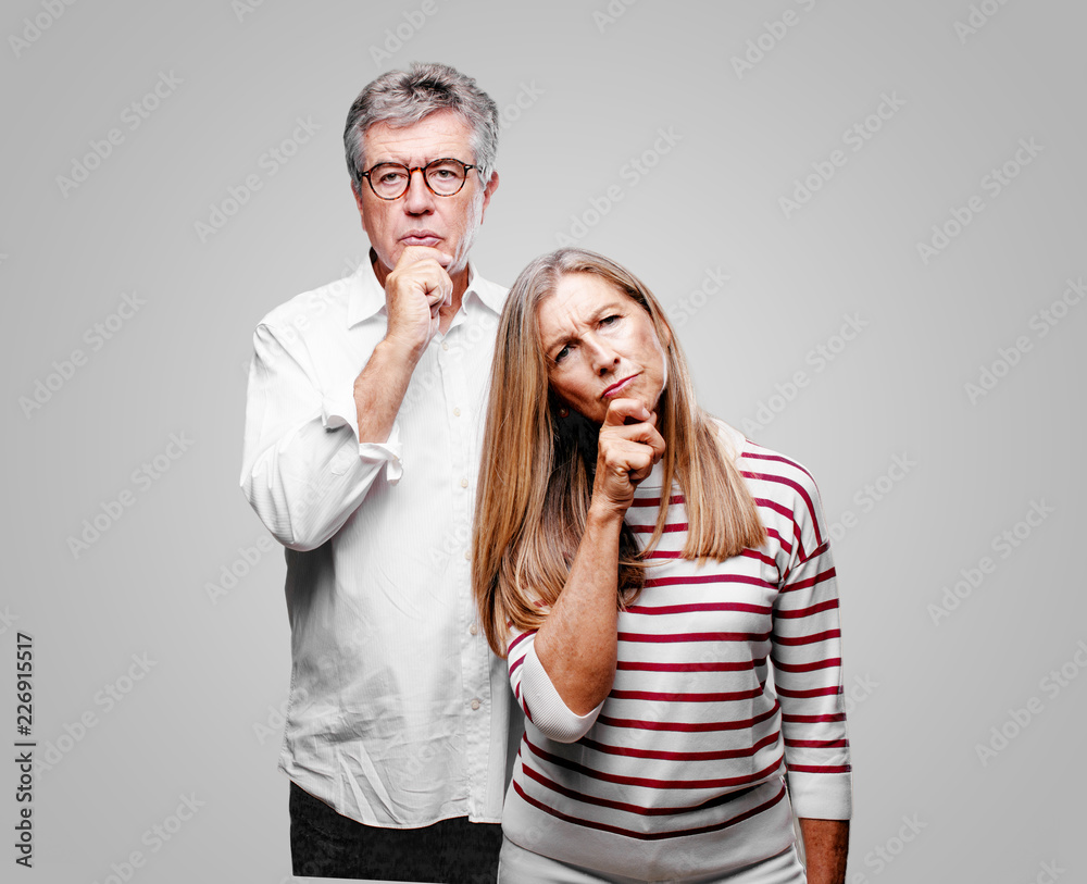 senior cool husband and wife with a goofy, dumb, silly look, feeling ...