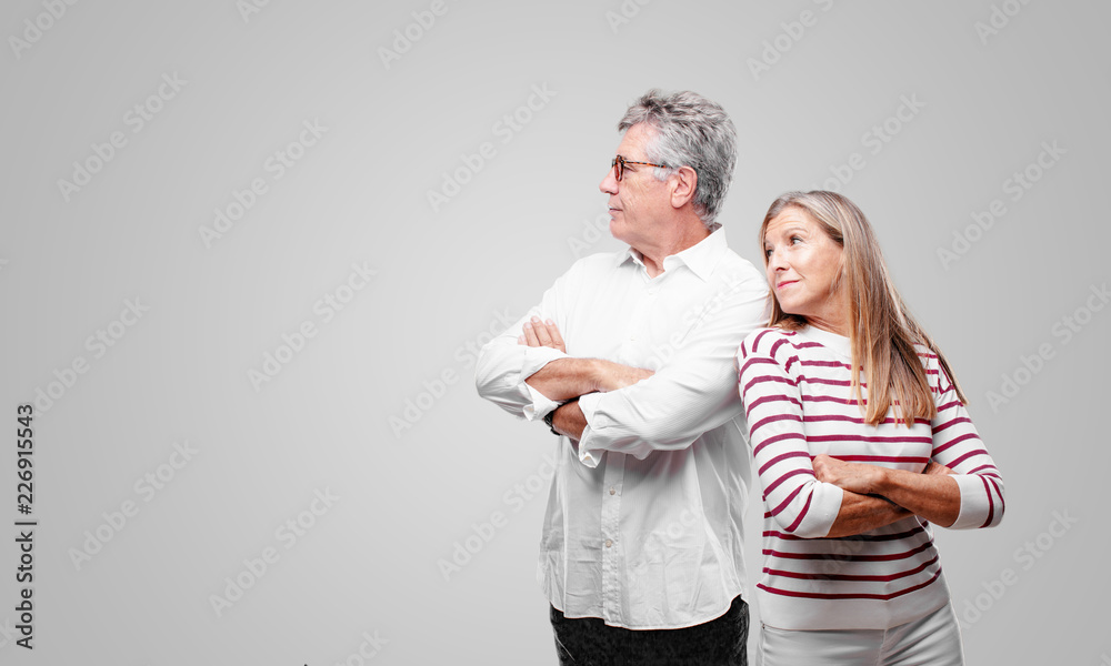 senior cool husband and wife with a dissenting, serious, stern ...
