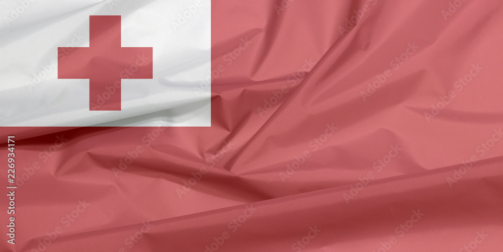 Fabric flag of Tonga. Crease of Tongan flag background, A red field ...