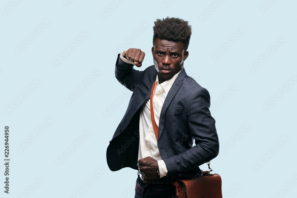 young black businessman with an angry, aggressive and menacing pose ...