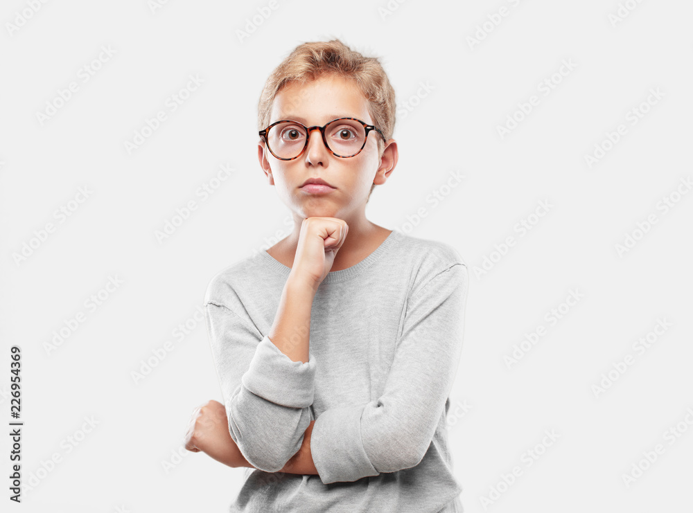 young blonde handsome boy with a goofy, dumb, silly look, feeling ...