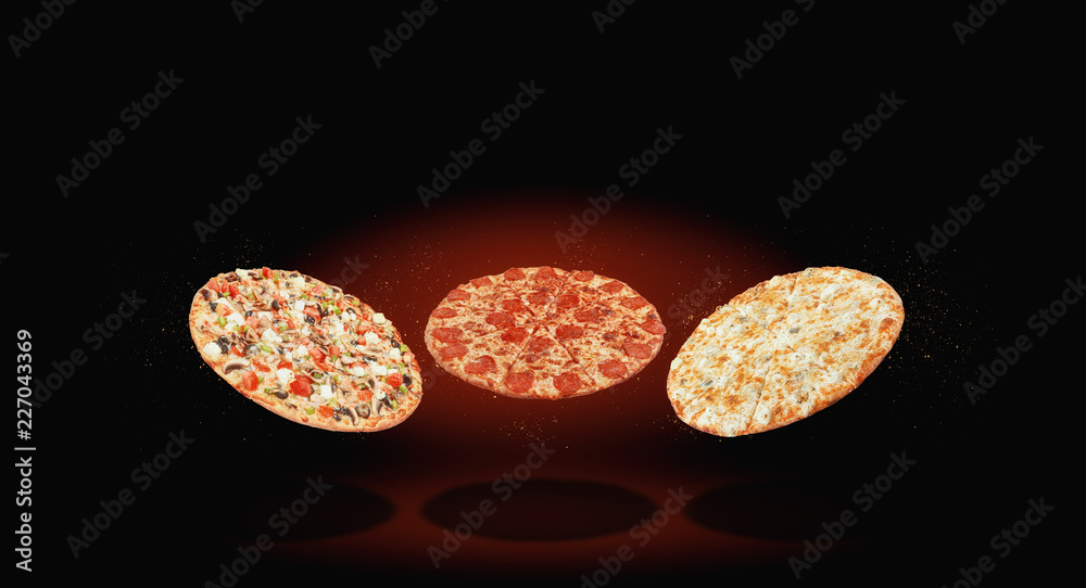 Three different pizza fly in the air against a dark background. menu ...