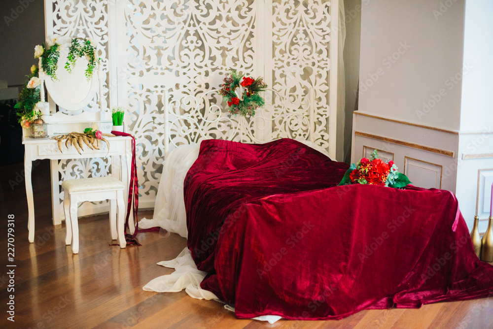 Bedroom interior with a large bed, a forged back with a boudoir table ...