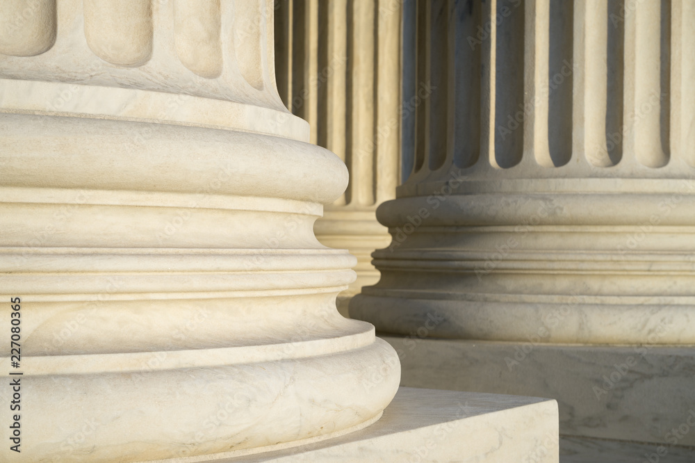 White marble neoclassical columns of the portico of the Supreme Court ...