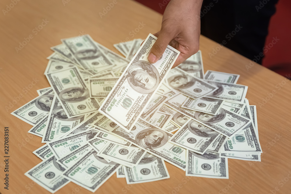 100 Dollar Bills Spread Out