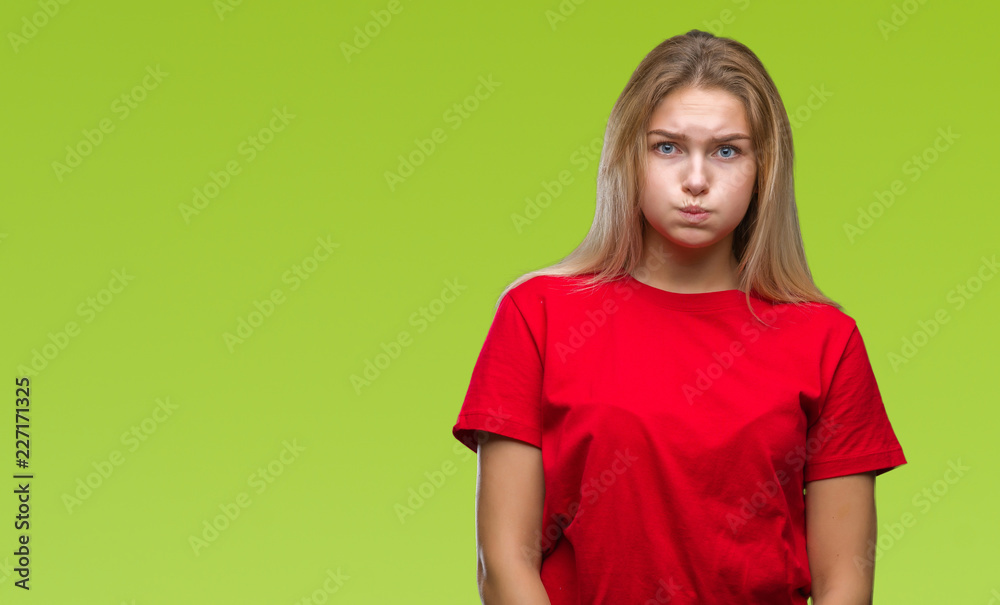 Young caucasian woman over isolated background puffing cheeks with ...