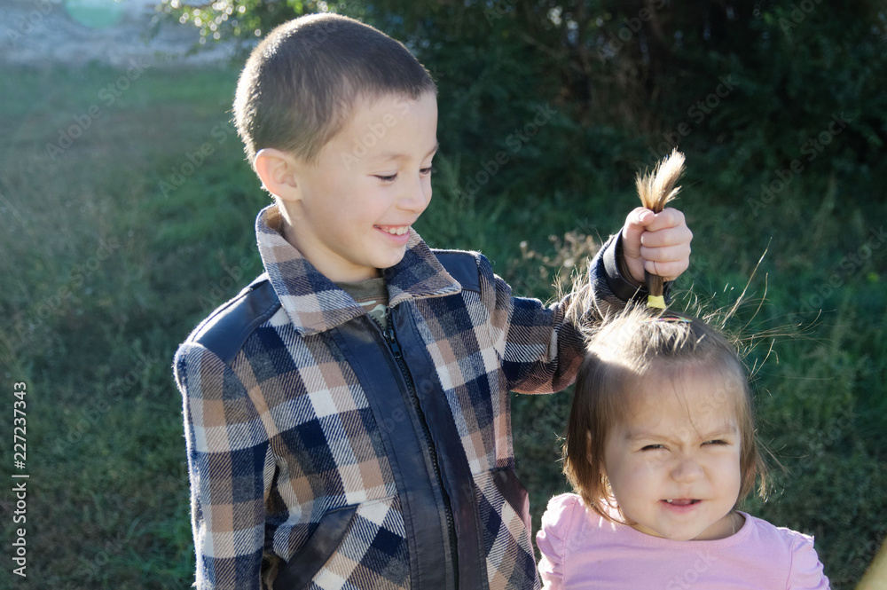 Children having fun. Boy and little girl portrait. Happy smiling ...