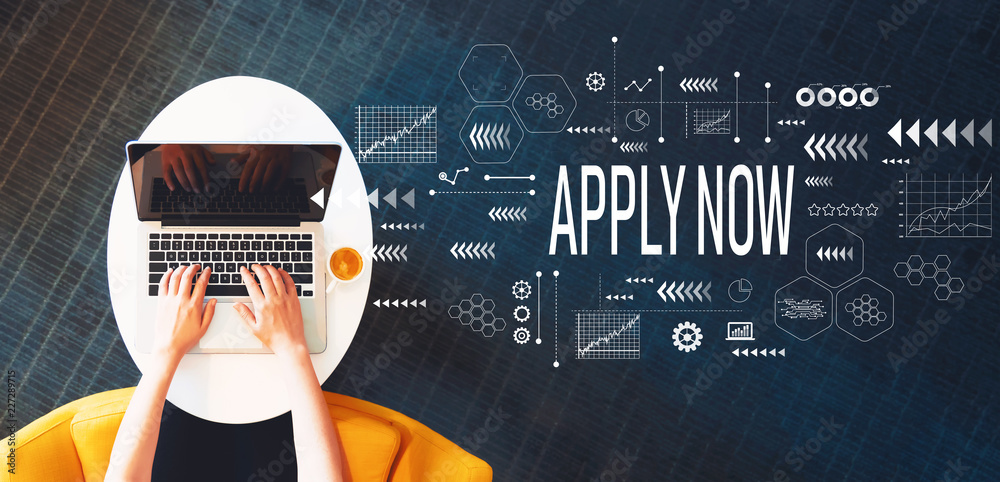 Apply now with person using a laptop on a white table Stock Photo ...
