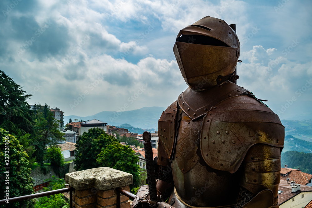 Medieval rusty war knight armor holding sword in front of italian ...