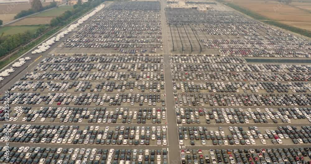 Aerial view of a new car depot, where you can see thousands of cars ...