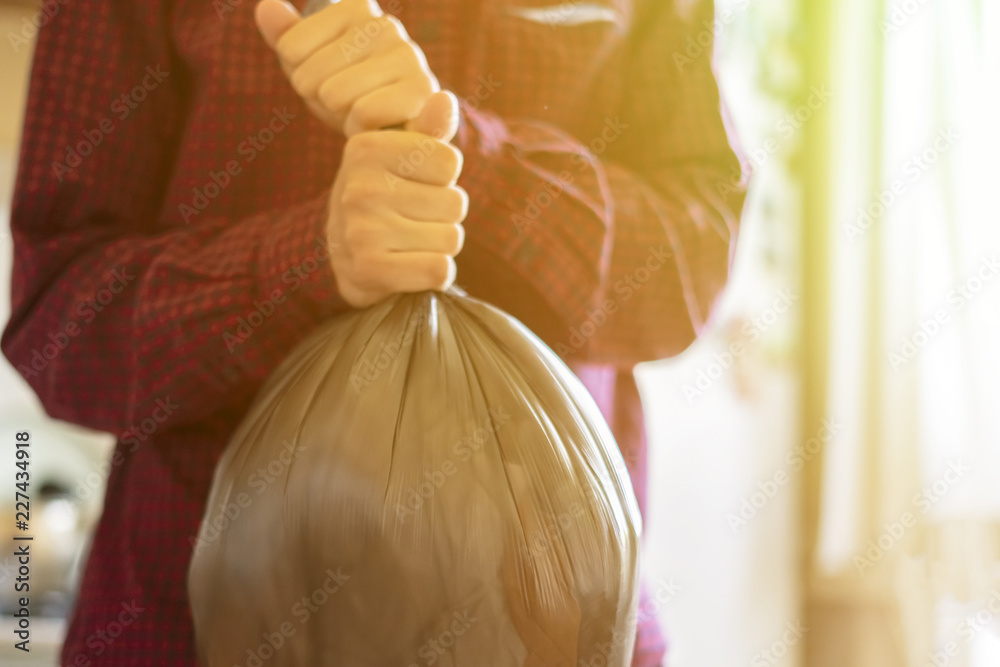 hand holding a trash garbage bag at home to take it away f Stock Photo ...
