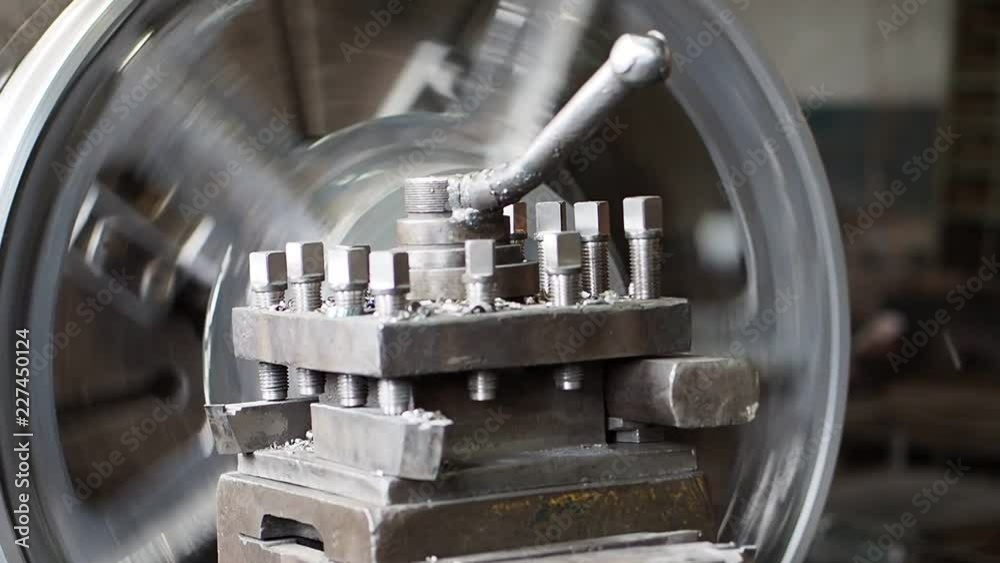 The machine processes a detail. The big metal mechanism of the machine ...