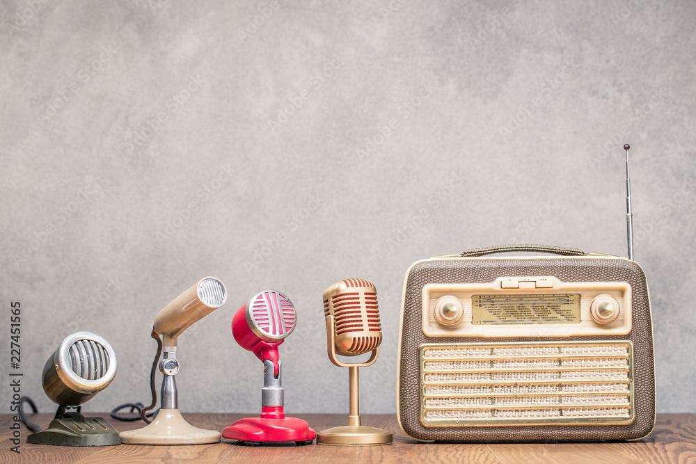 Retro portable broadcast radio receiver from circa 1950s and four ...