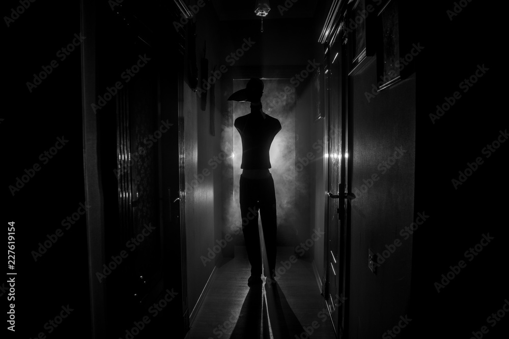 Creepy silhouette in the dark abandoned building. Horror Halloween ...