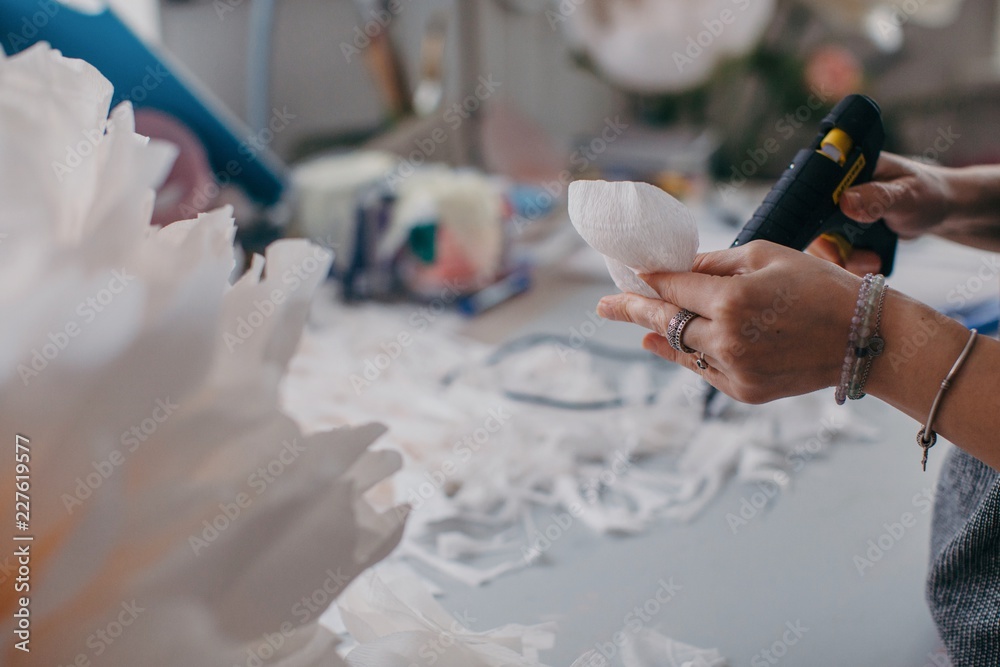 Crop hands creating beautiful paper flower Stock Photo | Adobe Stock