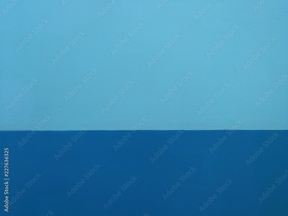 Full frame of blue wall in two tone, light and dark blue wall ...