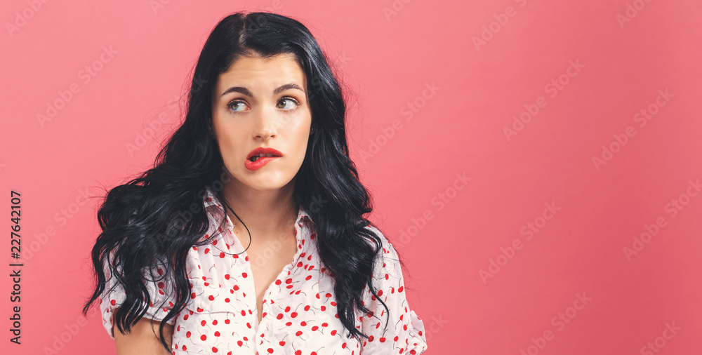 Bored young woman on a solid background Stock-Foto | Adobe Stock